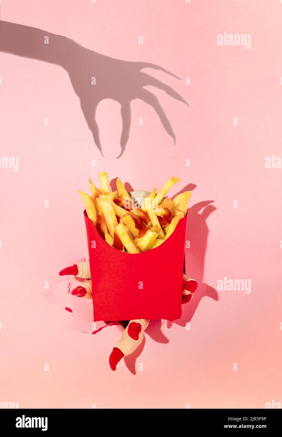 Creative layout made of witch's or zombie's hand shadow and french ...