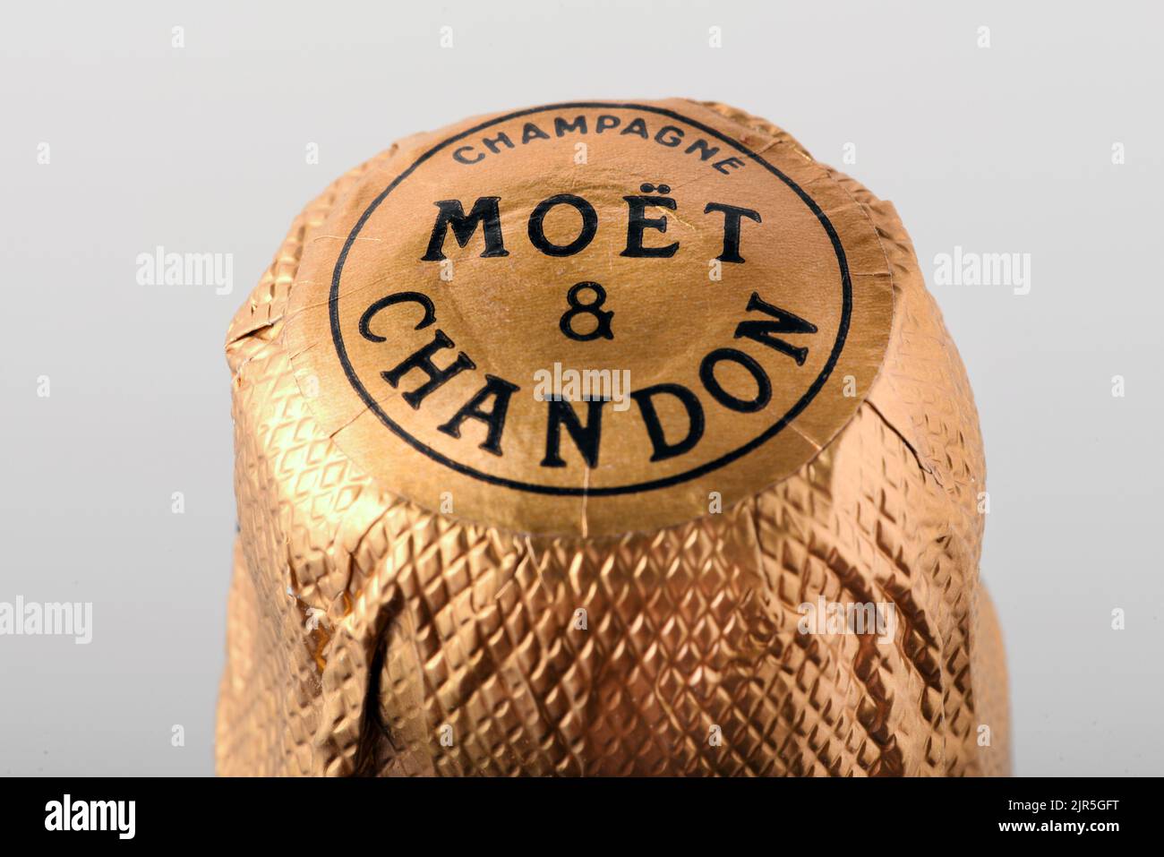 From above closeup of cork of Moet and Chandon champagne bottle covered ...