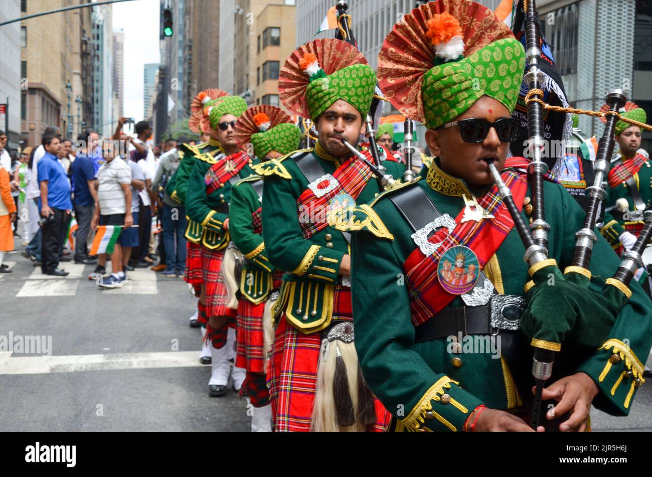 Marching band wearing traditional dress march along Madison Avenue ...