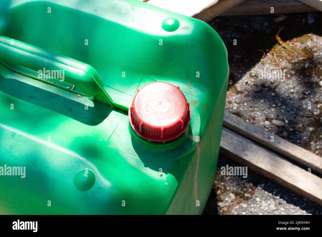 Large green canister of engine oil close up Stock Photo - Alamy