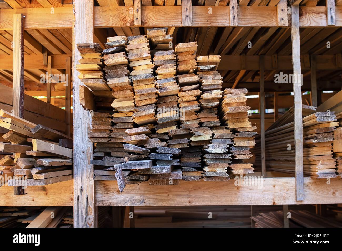 Folded finished boards at the sawmill closeup Stock Photo - Alamy