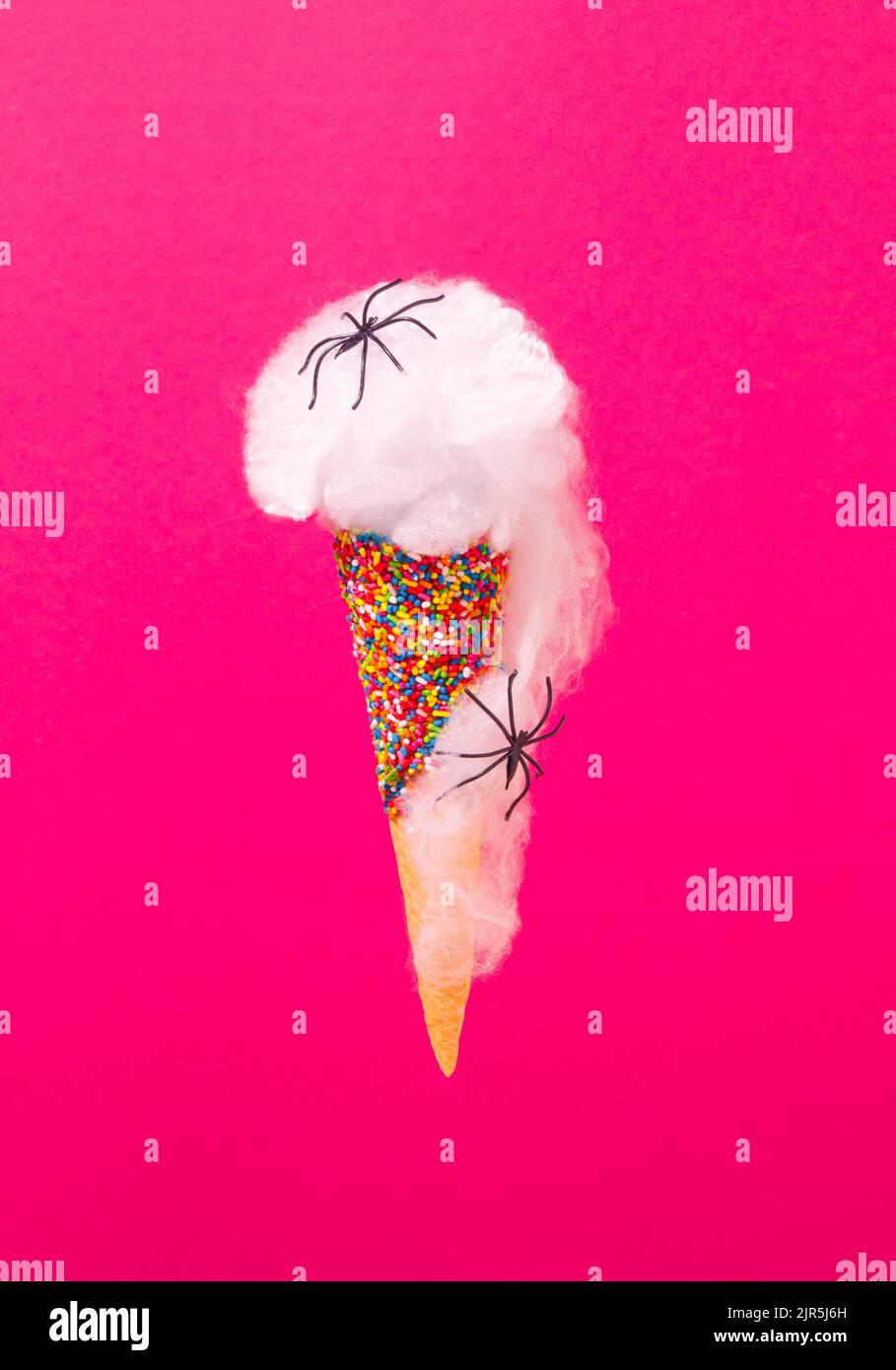 Minimal creative concept made of ice cream cone with sprinkles, spider ...