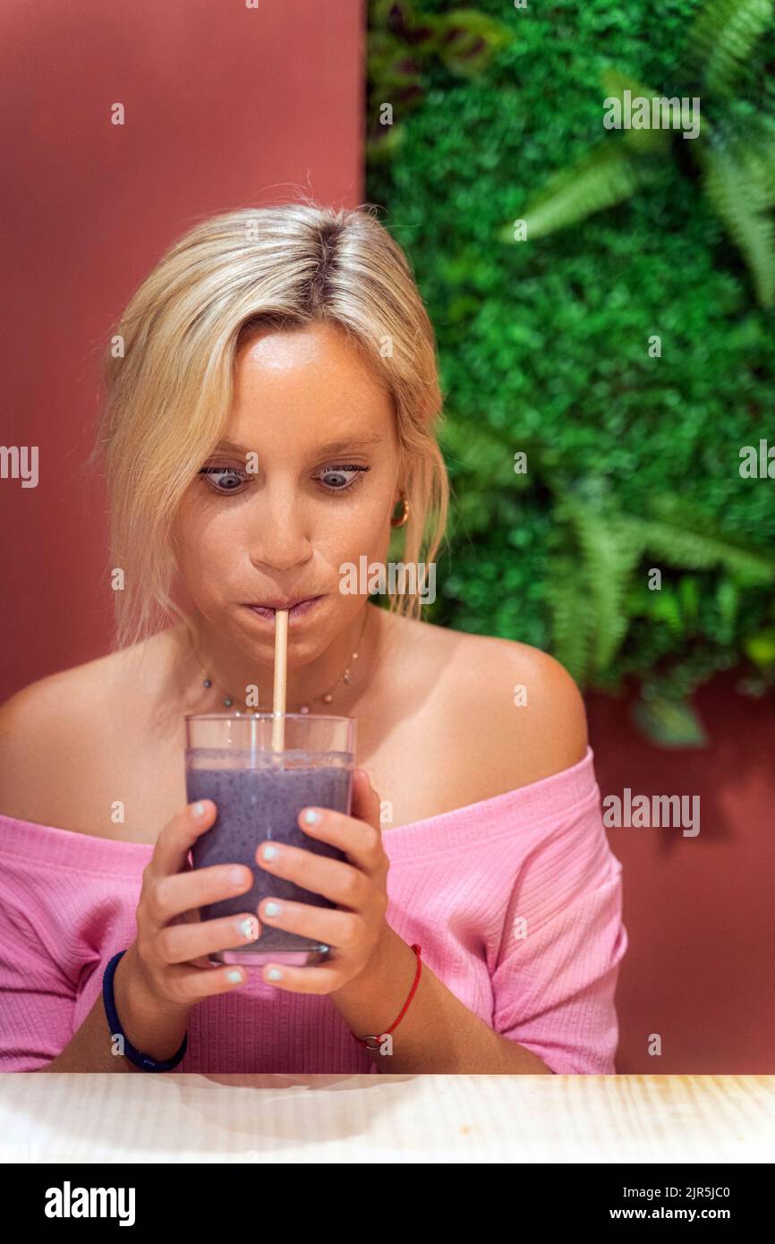 Woman Enjoying Drinking A Fresh Healthy Smoothie In A Coffee Shop Healthy Lifestyle And