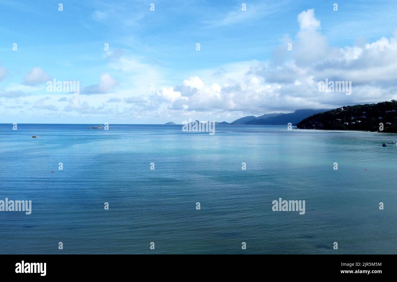 Beautiful panoramic landscape with clear blue ocean water and mountains ...