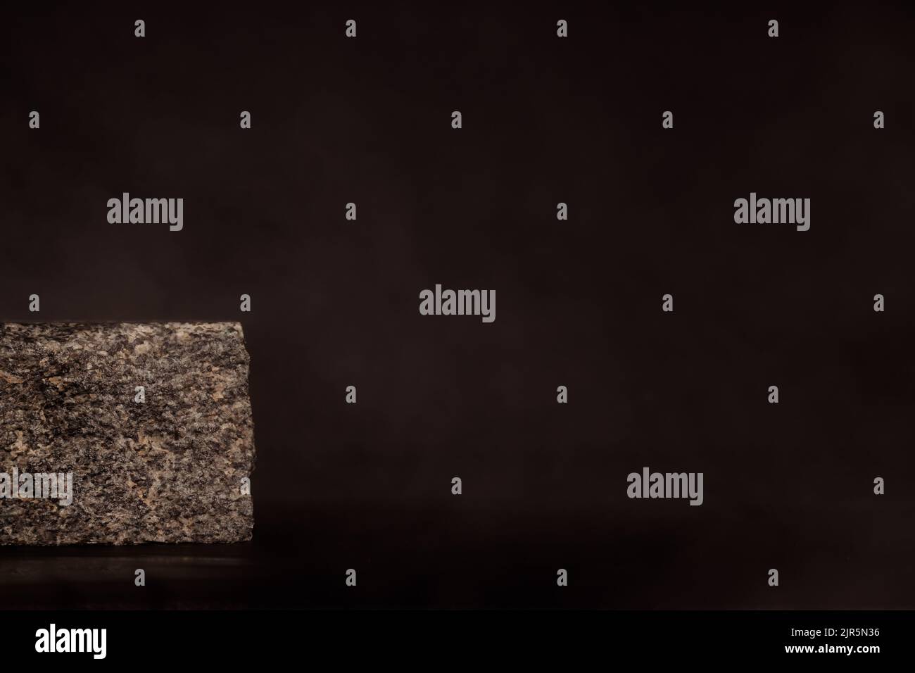 Minimalist, granite platform on a black background. Product ...