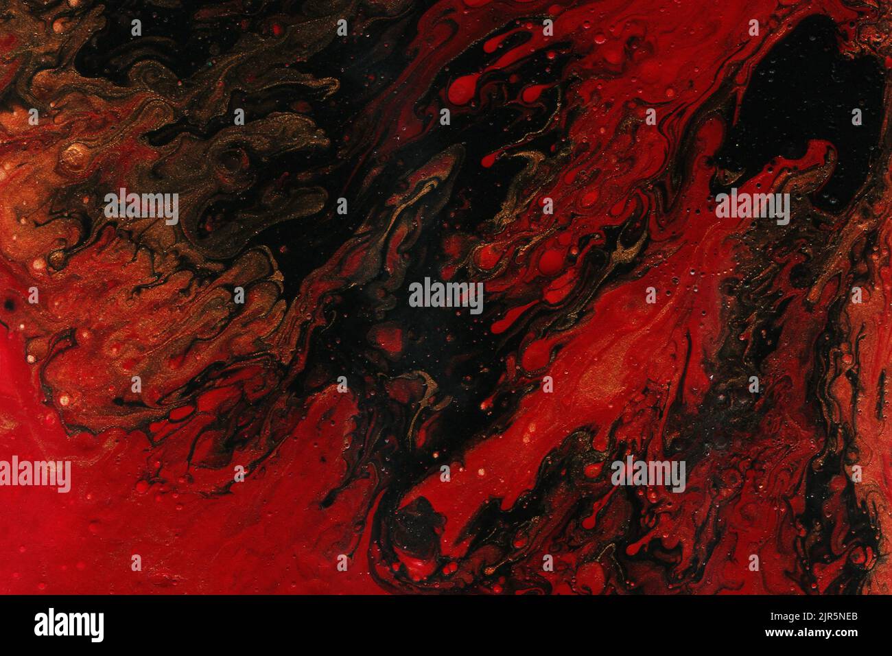 Acrylic texture made in fluid pour technique. Background in red and ...