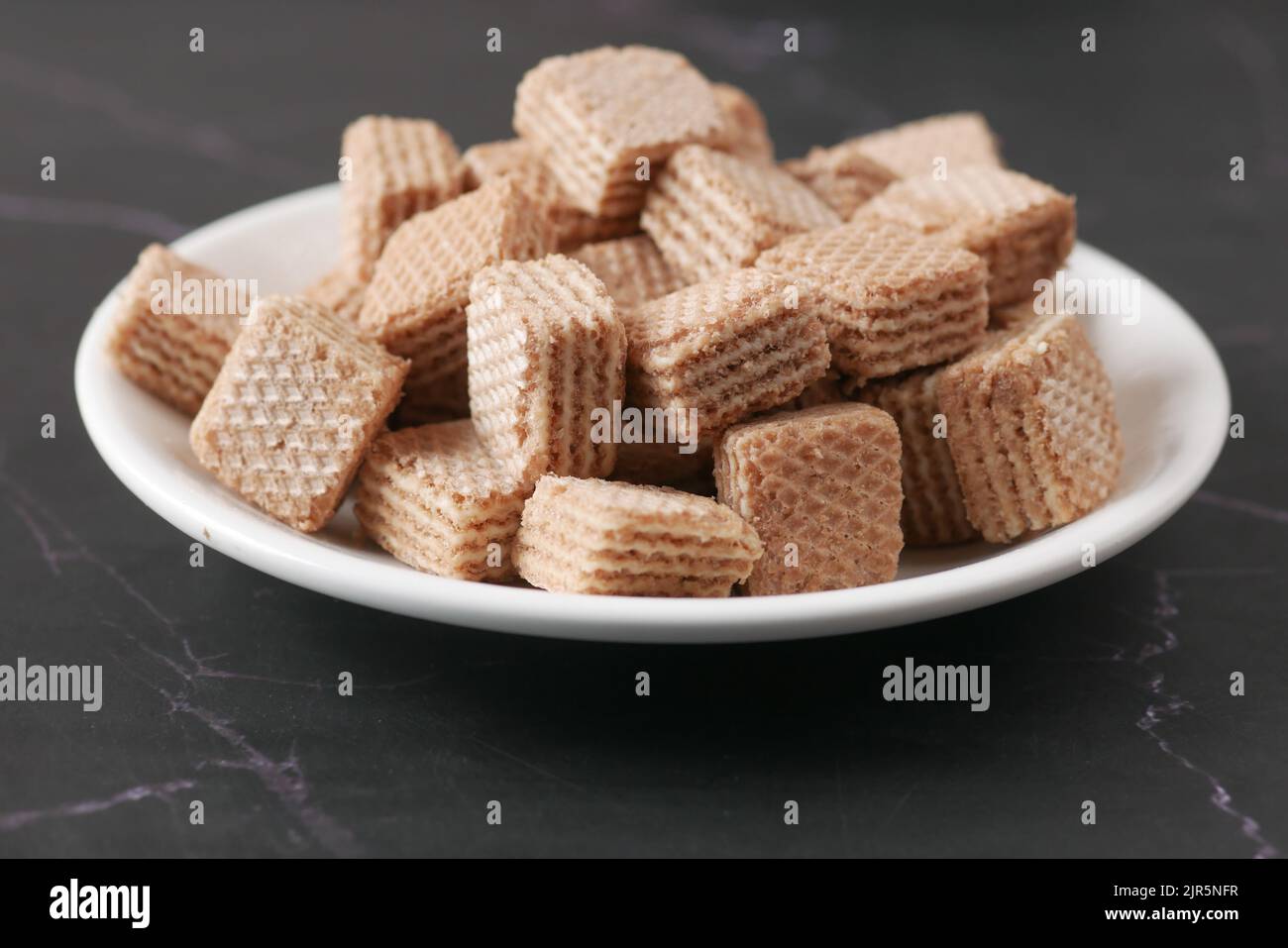 cube shape wafer biscuit on plate Stock Photo - Alamy