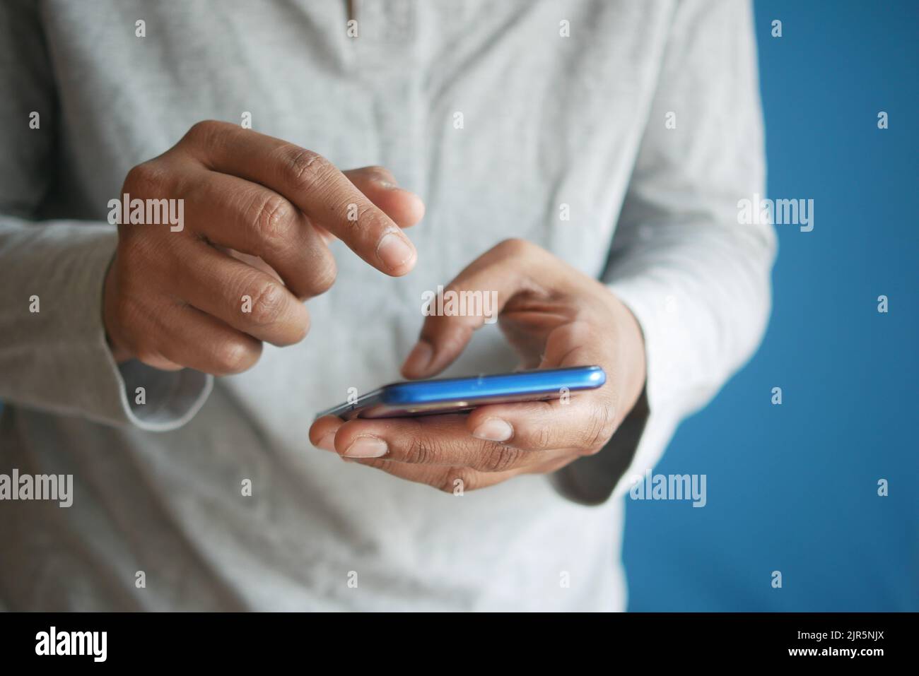 Close up of young man hand using smart phone Stock Photo - Alamy