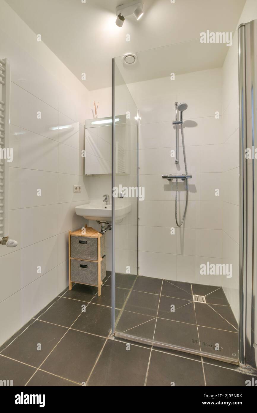 Modern home interior design of white bathroom with open bathtub and ...