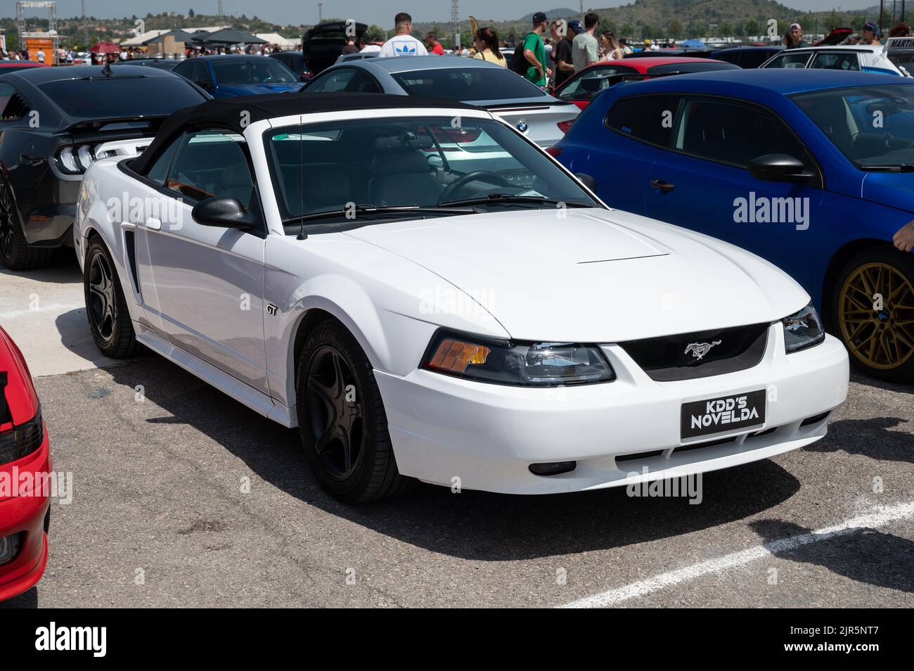 A clean white Ford Mustang GT convertible parked on a street Stock ...