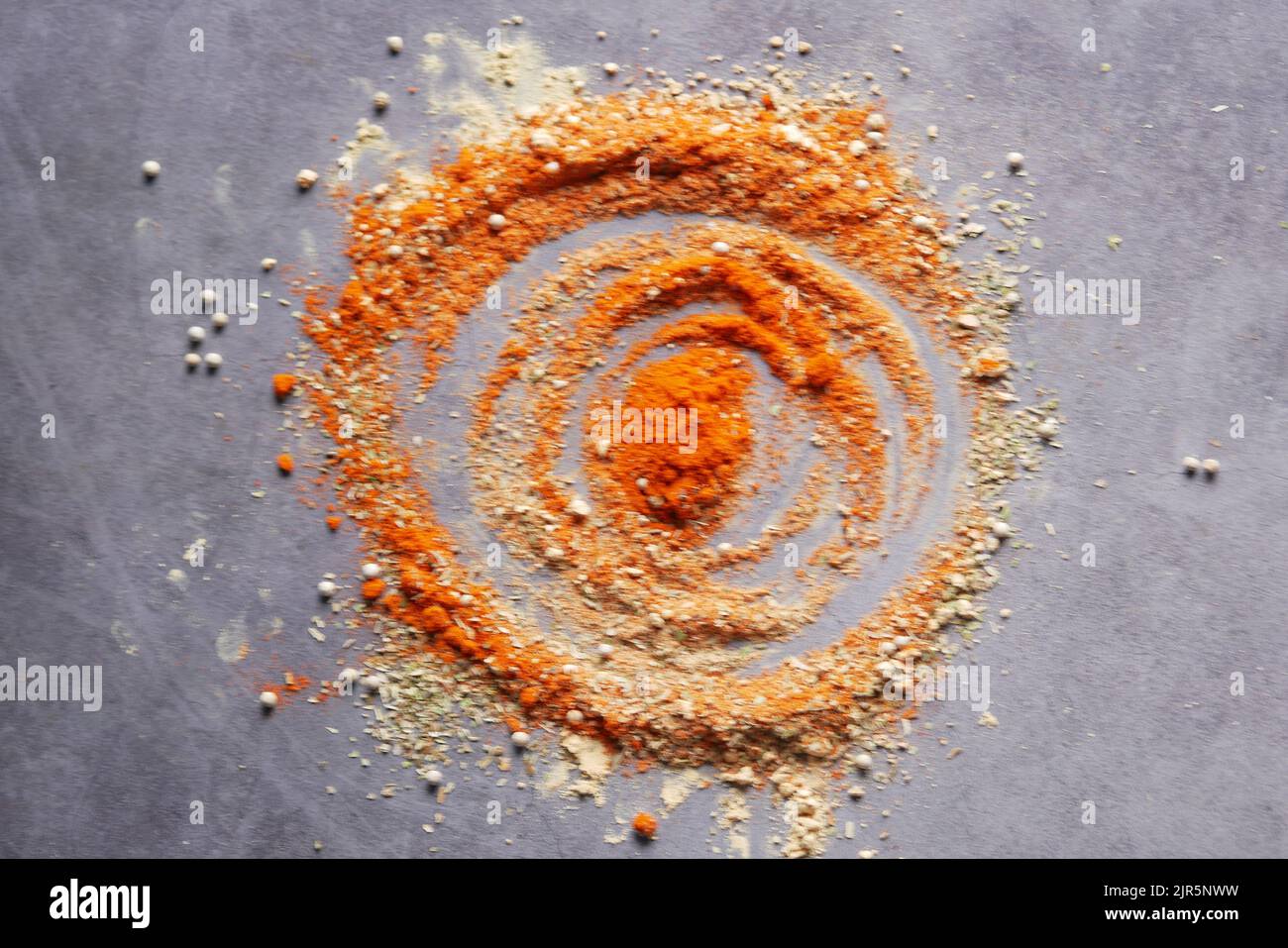 Mix of different flavored spices background Stock Photo - Alamy