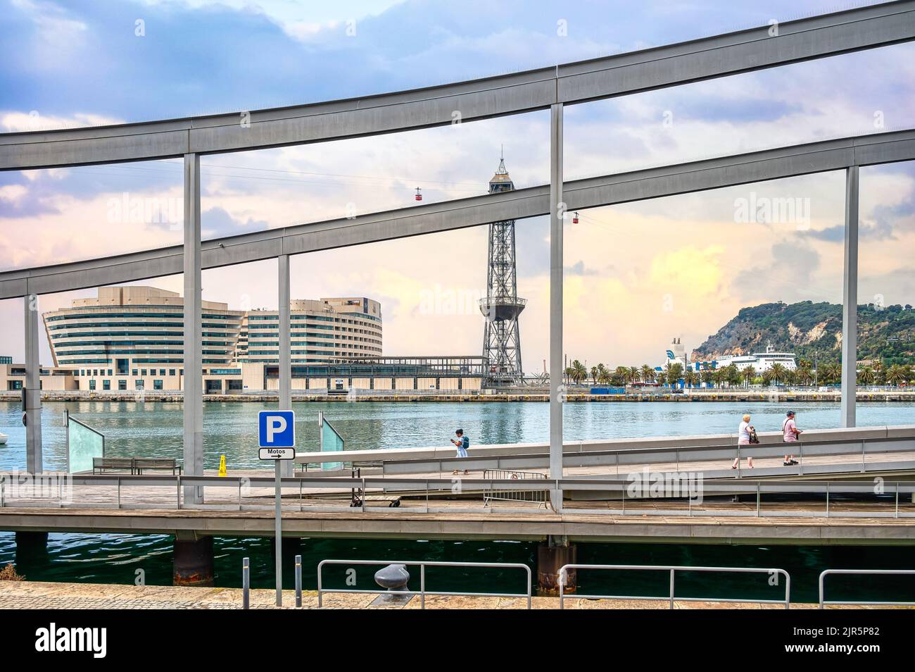 Barcelona World Trade Center framed in metallic structures of the port ...