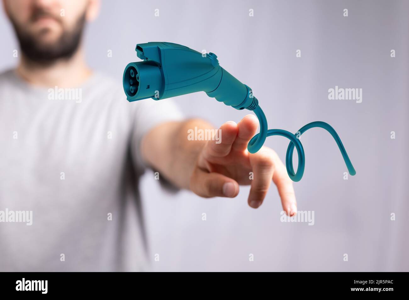 A 3d render of a man interacting with Power cable pump plug in charging ...