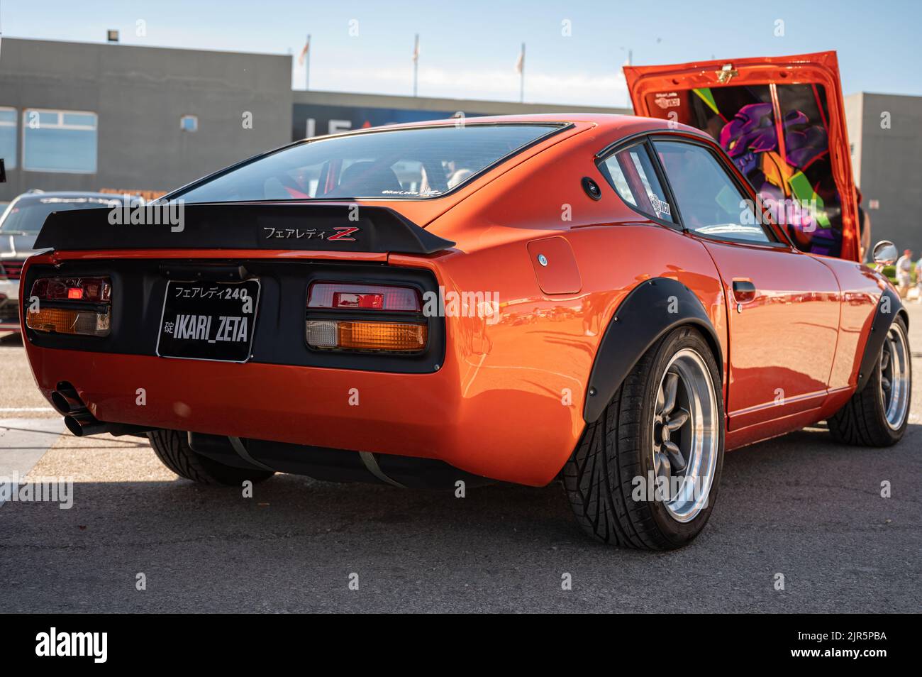 A classic orange Japanese Datsun 240z parked at an exhibition Stock Photo - Alamy