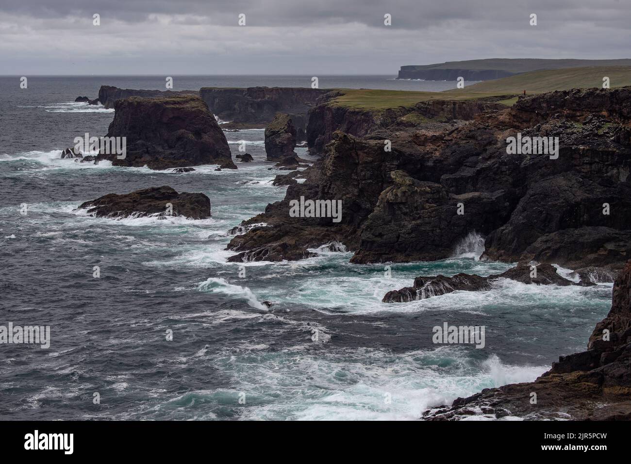 Eshaness cliffs in stormy seas. Shetland Stock Photo - Alamy