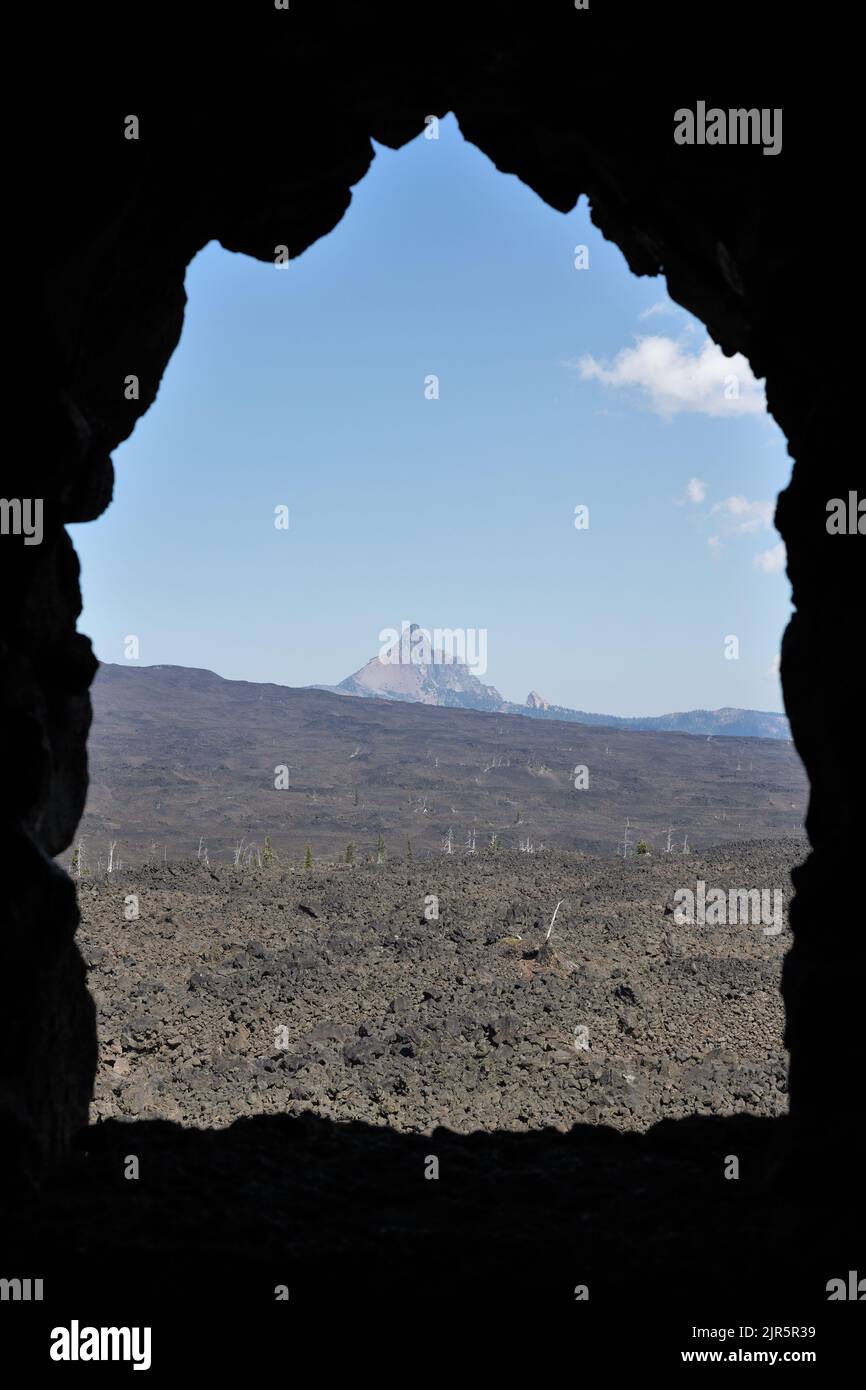 View of a mountain peak in the distance, beyond the lava flow, as seen ...