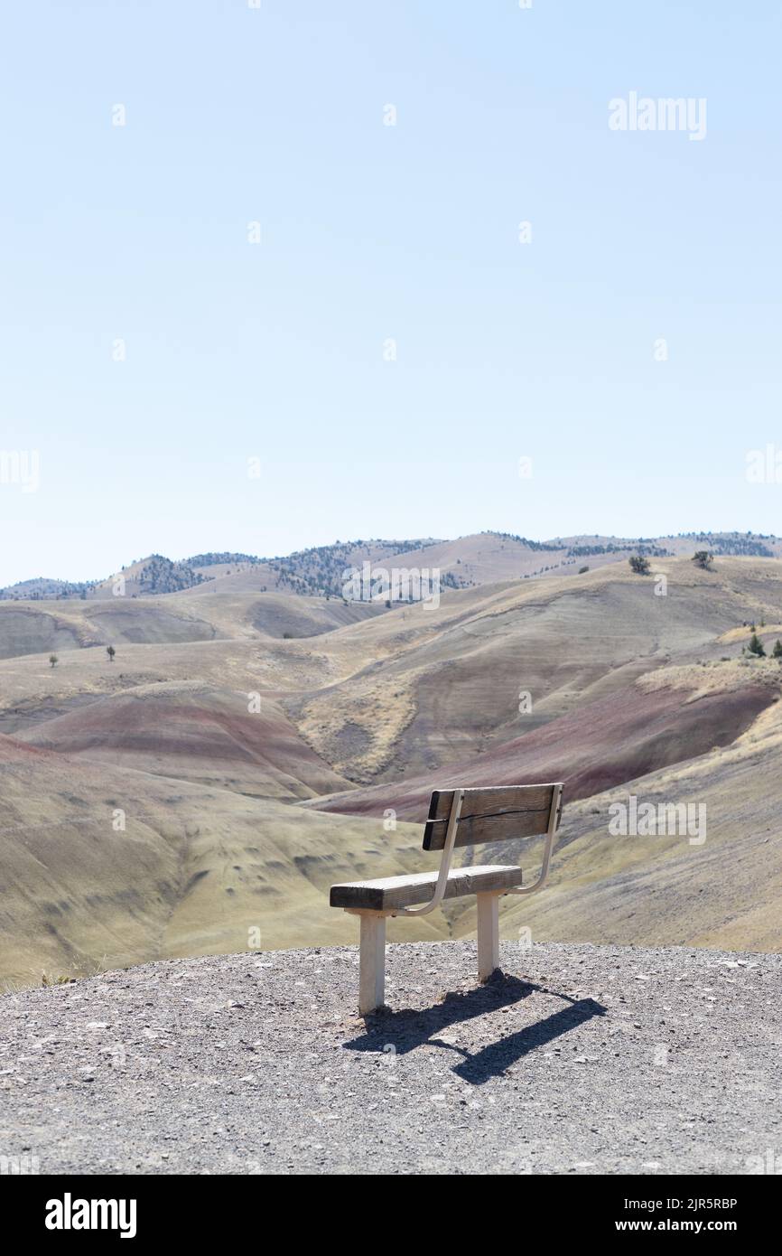 An empty bench facing the Painted Hills in Oregon, USA Stock Photo - Alamy