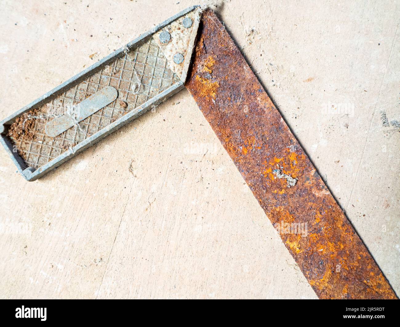 oldie rusted Iron Ruler with angle bar, set square Stock Photo - Alamy