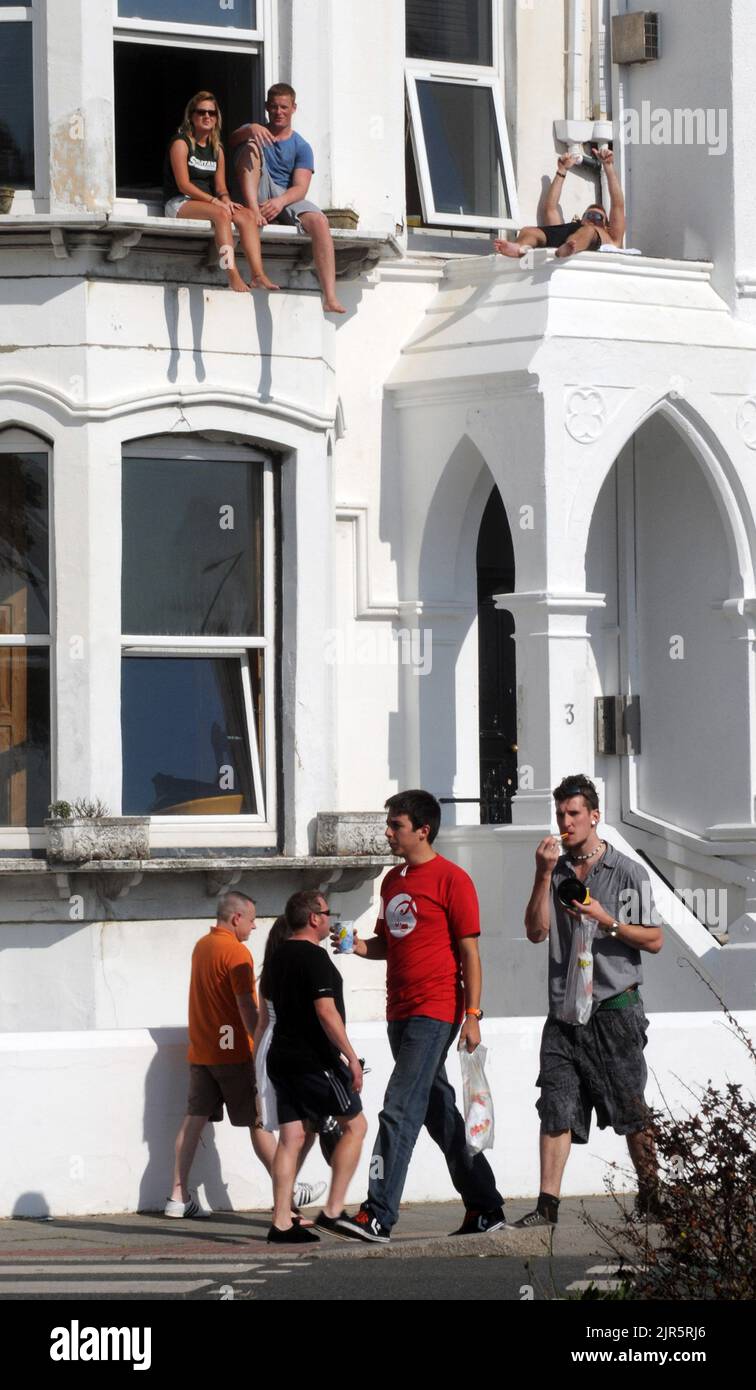 TAKING IN THE SUN ON THE WINDOW LEDGE AT OSBORNE ROAD, SOUTHSEA, HANTS ...