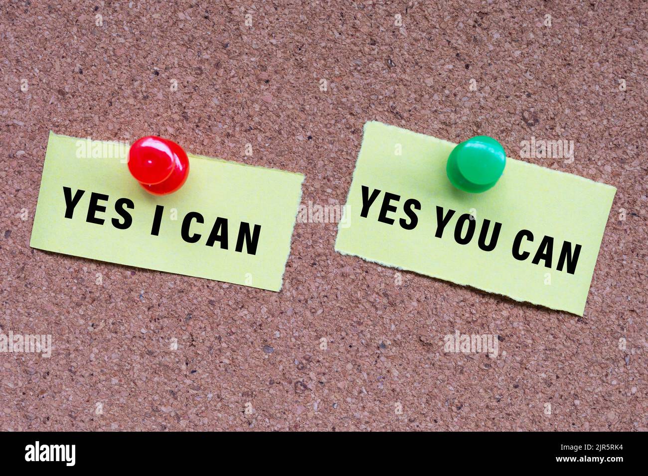 Yes I Can and Yes You Can words on stick note and pinned to a cork ...