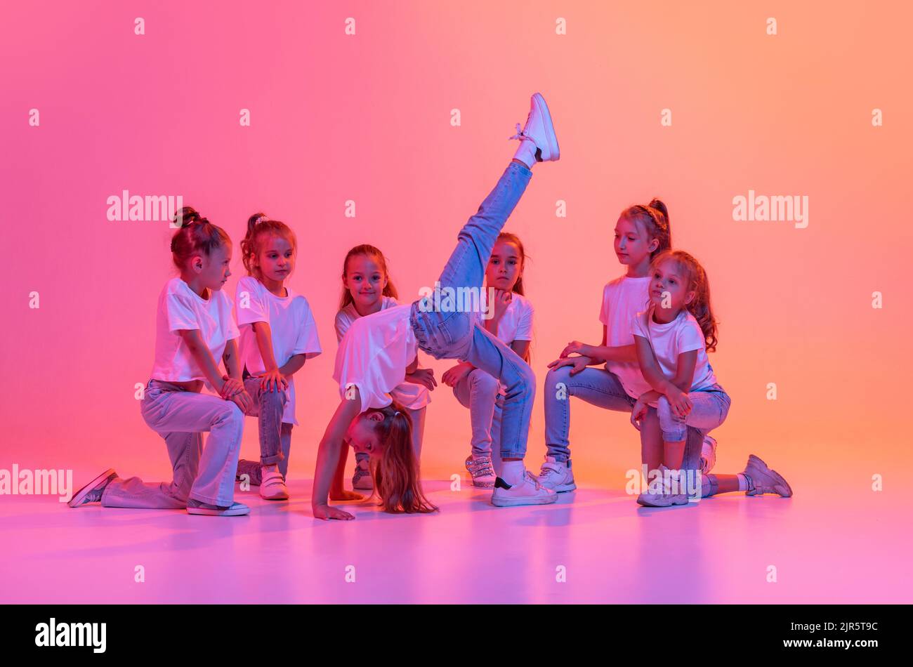 Group of children, school age girls in sportive casual style clothes ...