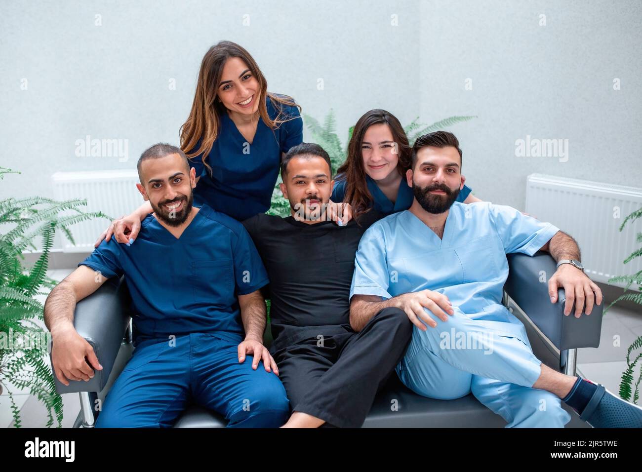 A group of students in the lobby of the medical university. A team of ...