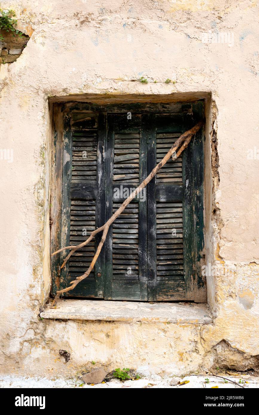 Stick against broken windows Stock Photo - Alamy