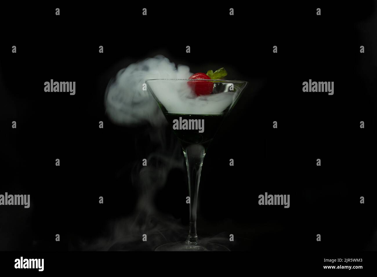 Gothic macabre drink in the dark glass emanating white smoke cooled ...