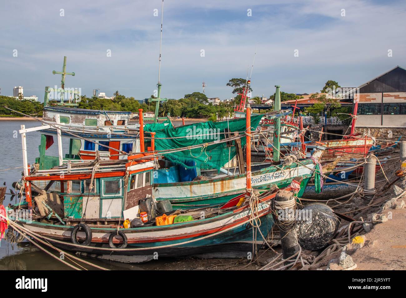 Thai fishing boats at a pier or wharf in Thailand Southeast Asia Stock ...