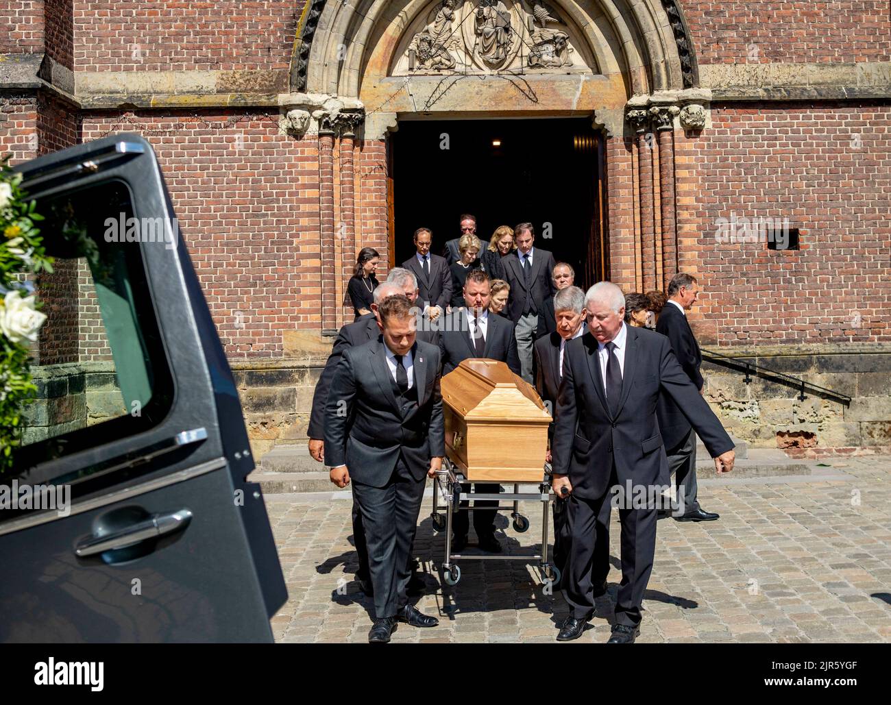 the coffin is carried outside at the l eglise Saint-Pierre in Bel il ...