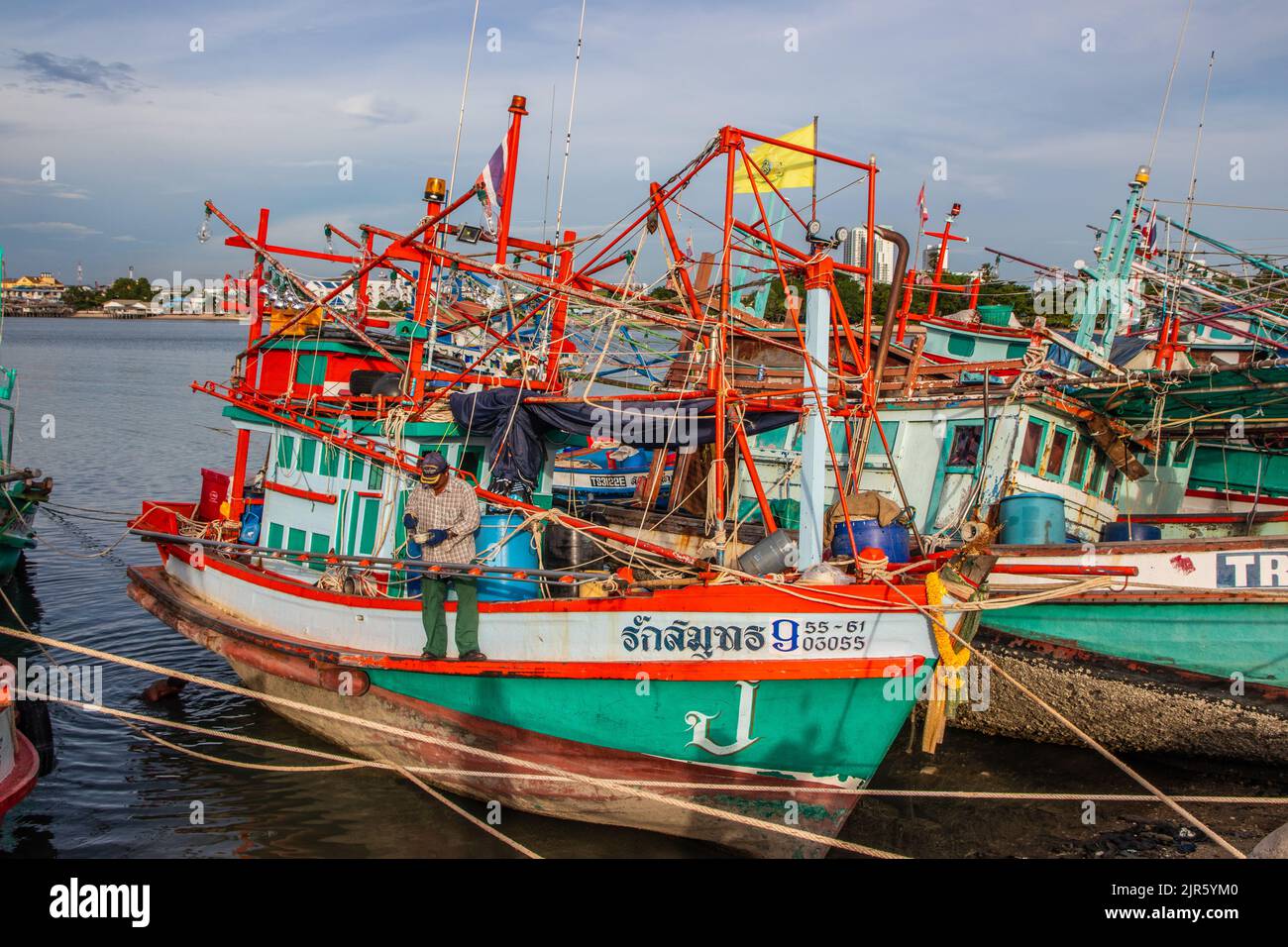 Thai fishing boats at a pier or wharf in Thailand Southeast Asia Stock Photo - Alamy