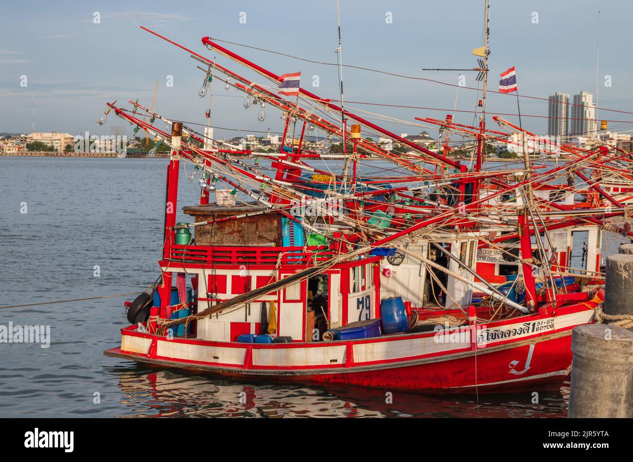Thai fishing boats at a pier or wharf in Thailand Southeast Asia Stock Photo - Alamy