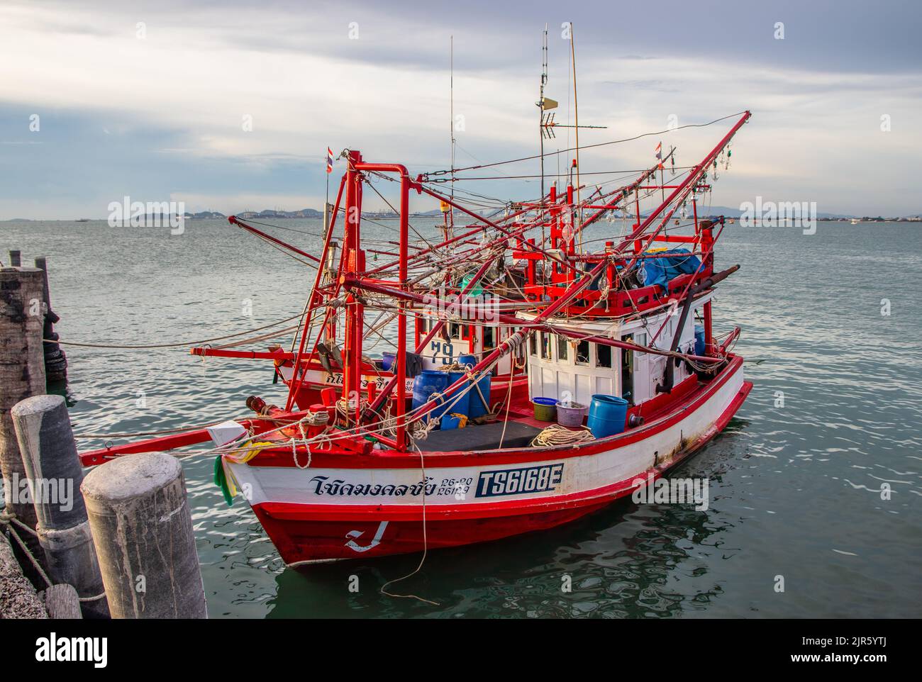 Thai fishing boats at a pier or wharf in Thailand Southeast Asia Stock Photo - Alamy