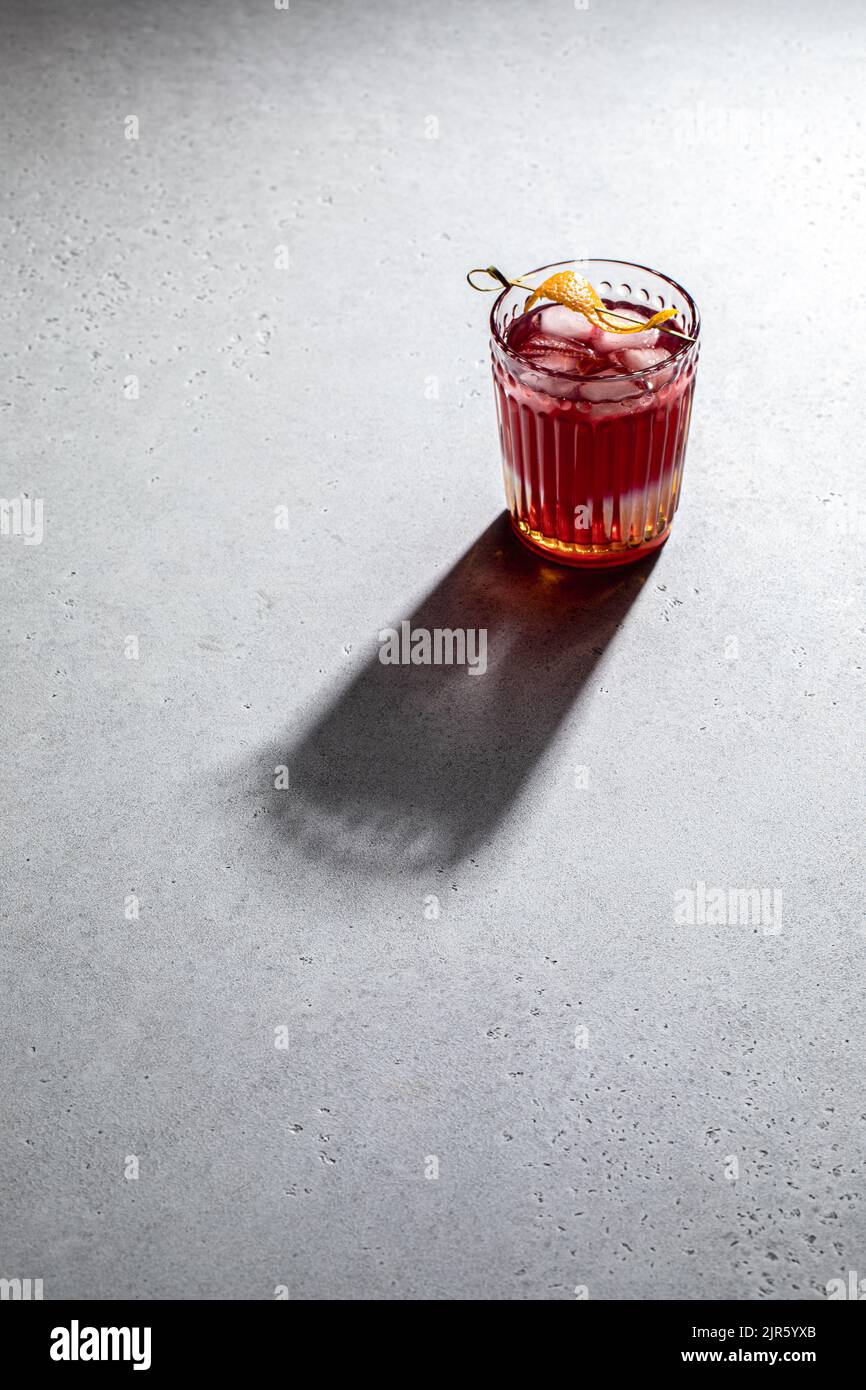 Iced cold lemonade in glass with shadow isolated on concrete tabletop. Abstract background Stock ...