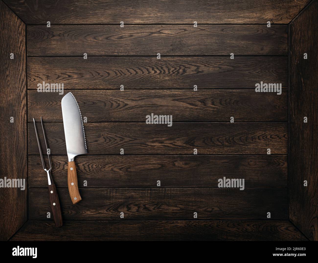 Vintage meat knife and fork over wood table. Top view Stock Photo - Alamy