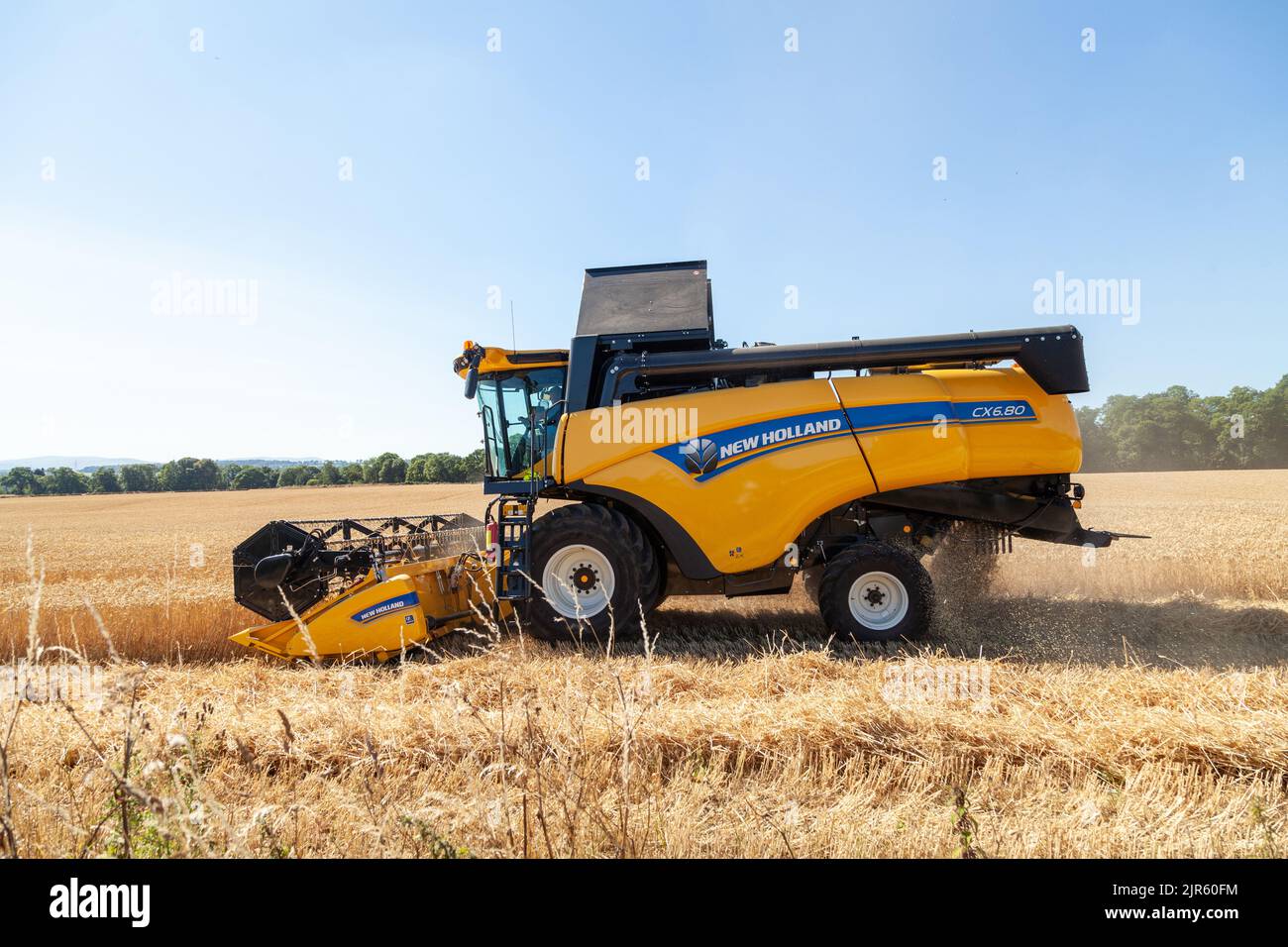 Machinery harvesting crops on field hi-res stock photography and images ...