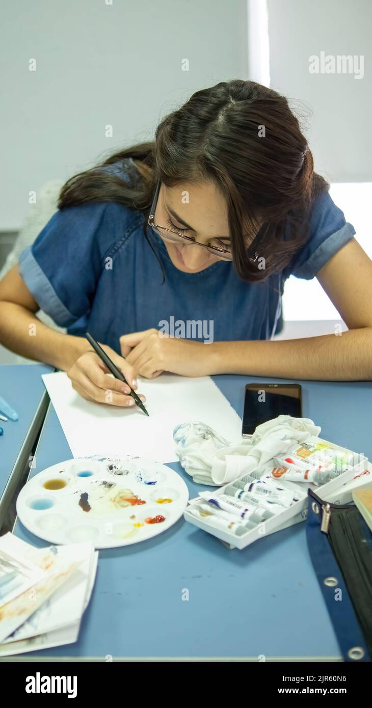 person drawing by hand with pen, pencil and ink, architectural ...