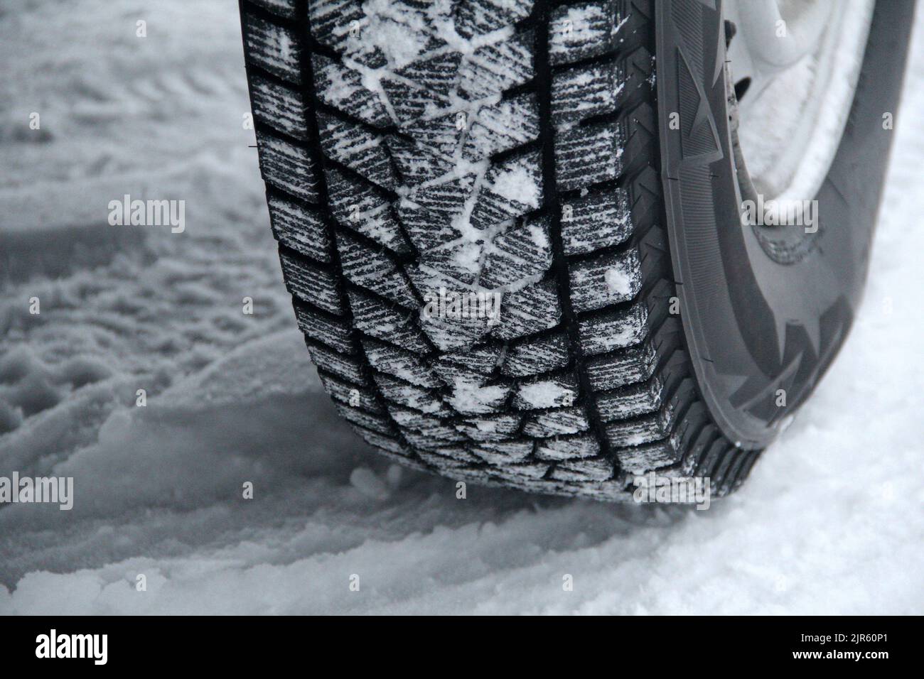 Traces of tread blocks of winter tires under off road vehicle wheel ...