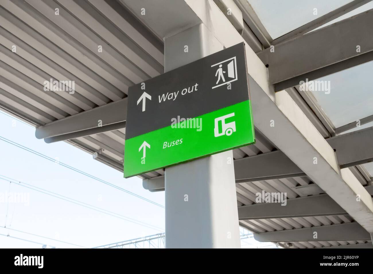 Sign green showing where the exit way out and stop of public transport ...