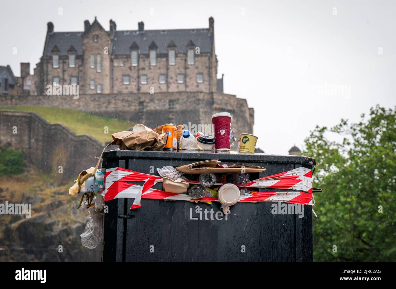 A bin overflowing with litter on Castle Street in Edinburgh city centre ...