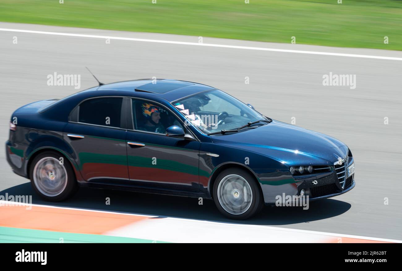 A dark blue Alfa Romeo 159 car on the Valencia racing circuit Stock ...