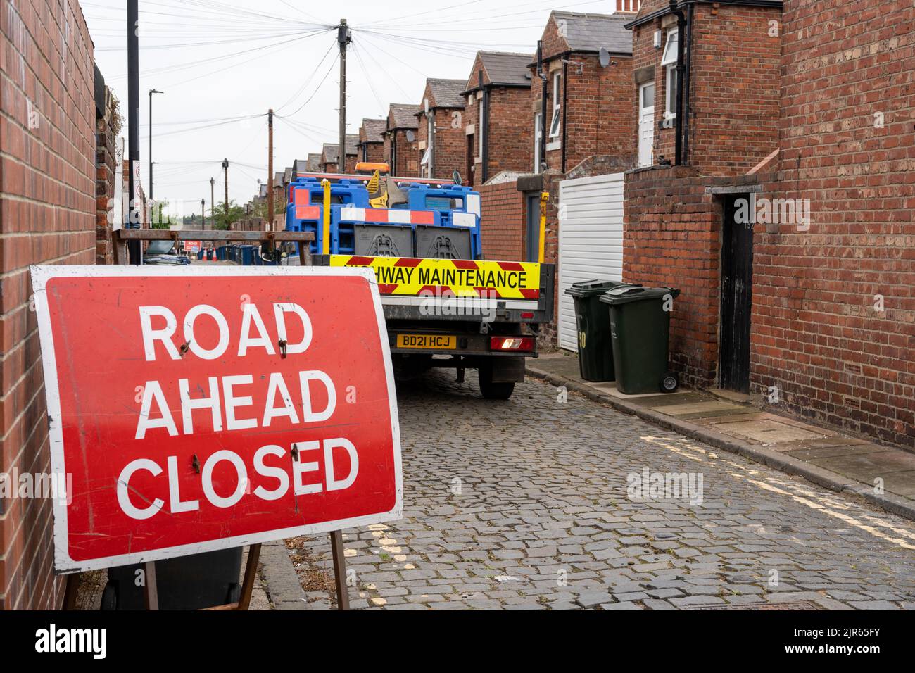 A sign reads 'Road Ahead Closed' in a back lane in Newcastle upon Tyne ...