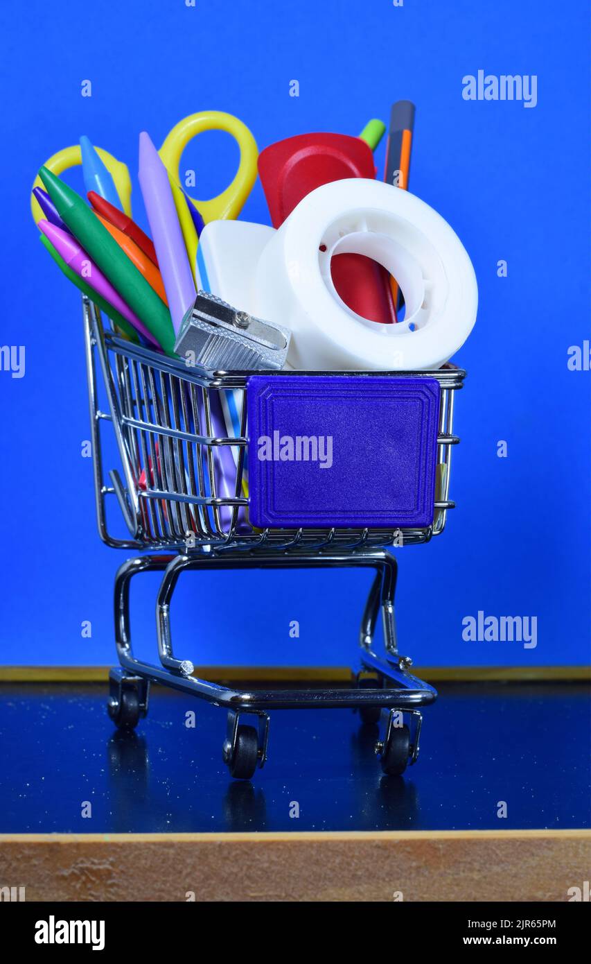 An assorted school supplies scattered on the blue background Stock ...