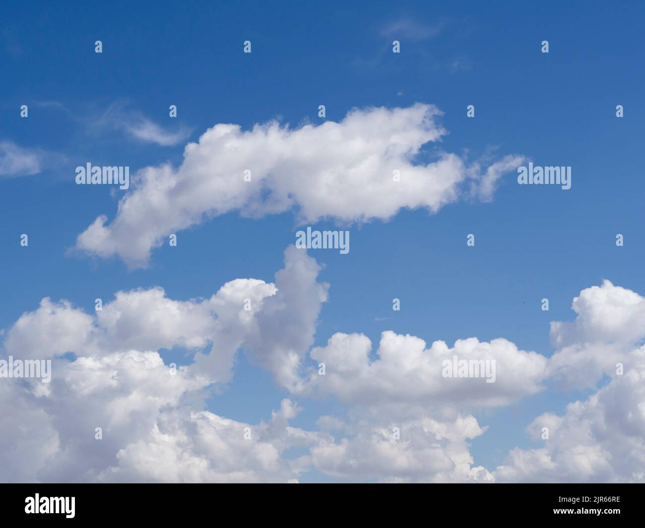 wallpaper of a blue sky with clouds. Wallpaper of a blue sky with clouds Stock Photo - Alamy