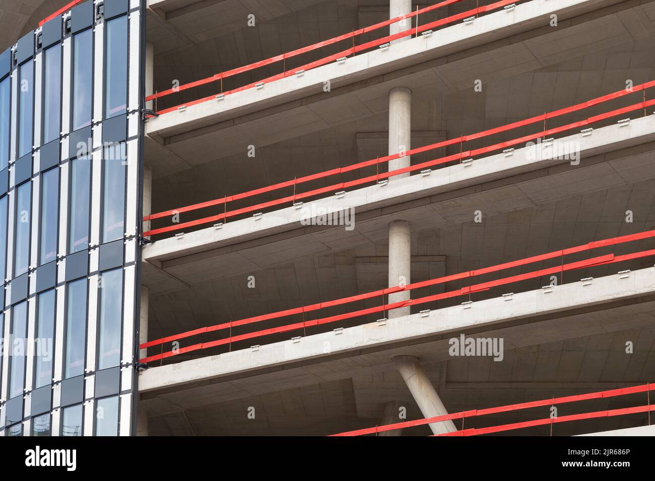 Incomplete reinforced concrete building floor. Exterior facade Windows ...