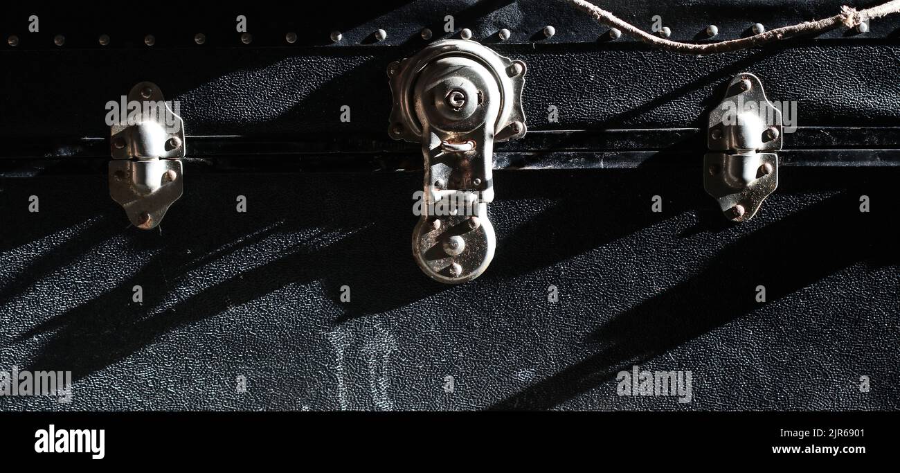 Close up on metal closure of very old black trunk Stock Photo - Alamy