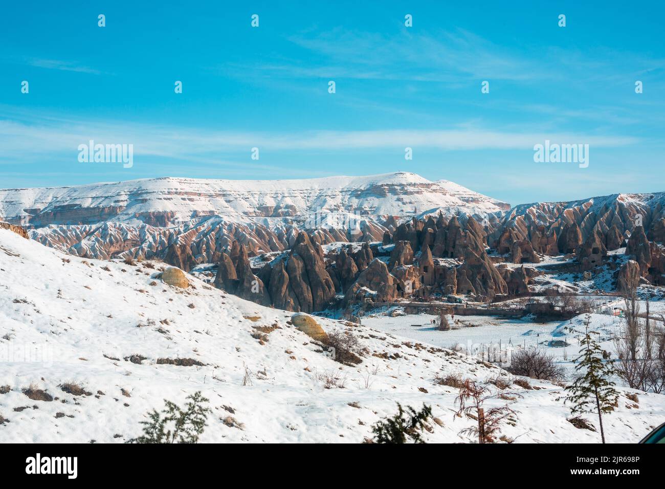 A beautiful scenery of rocky mountains covered in white snow in winter ...