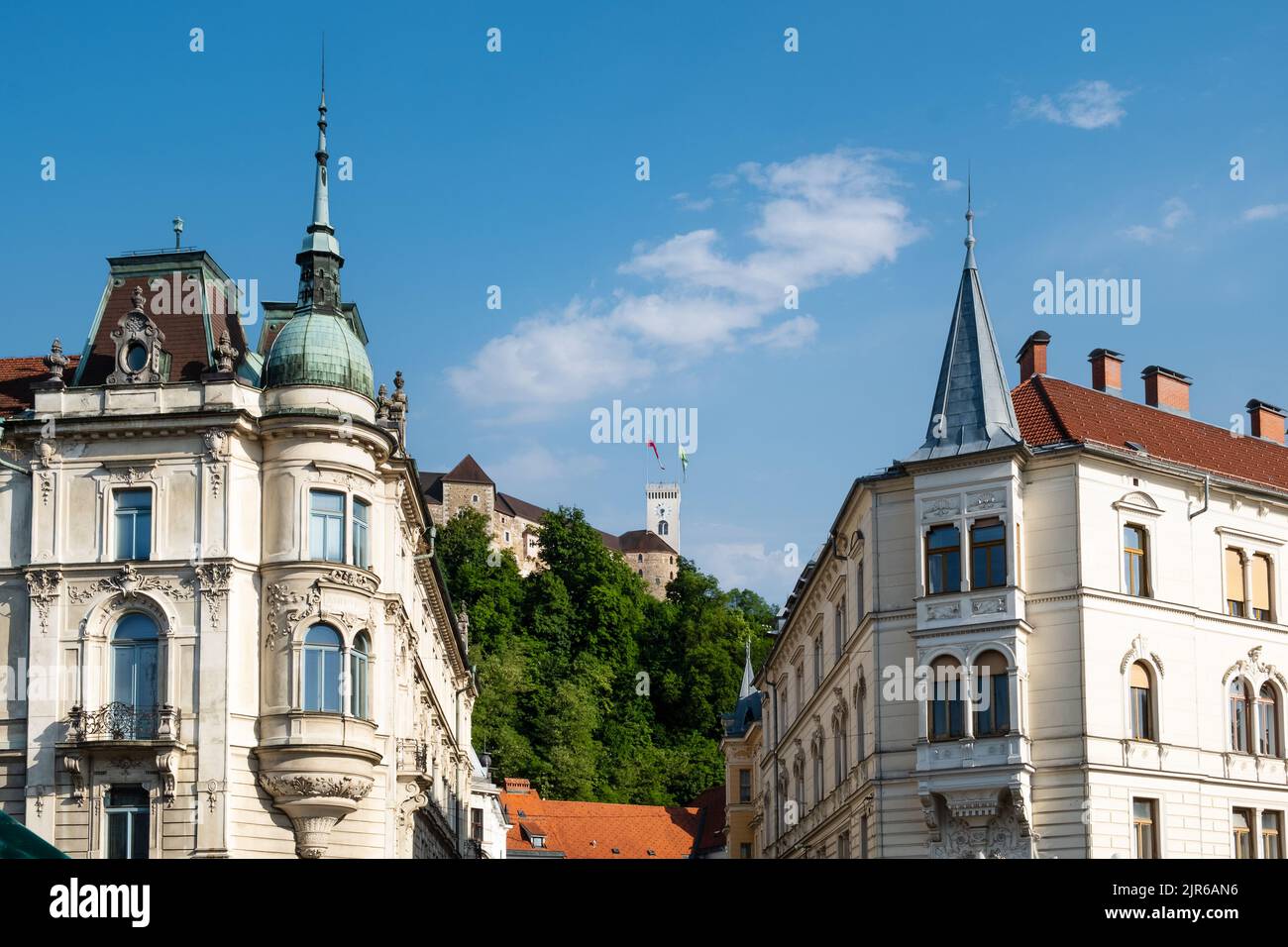 Ljubljana castle looms over the center of Old Town Ljubljana in ...