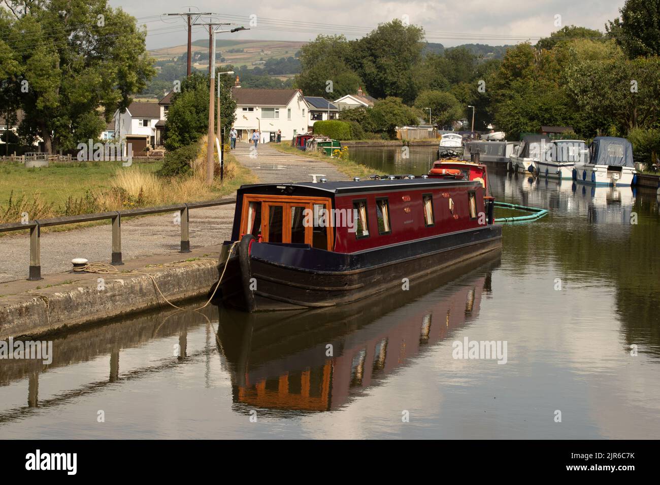A Silsden narrowboat is moored up at the top of the Bingley Five Rise ...