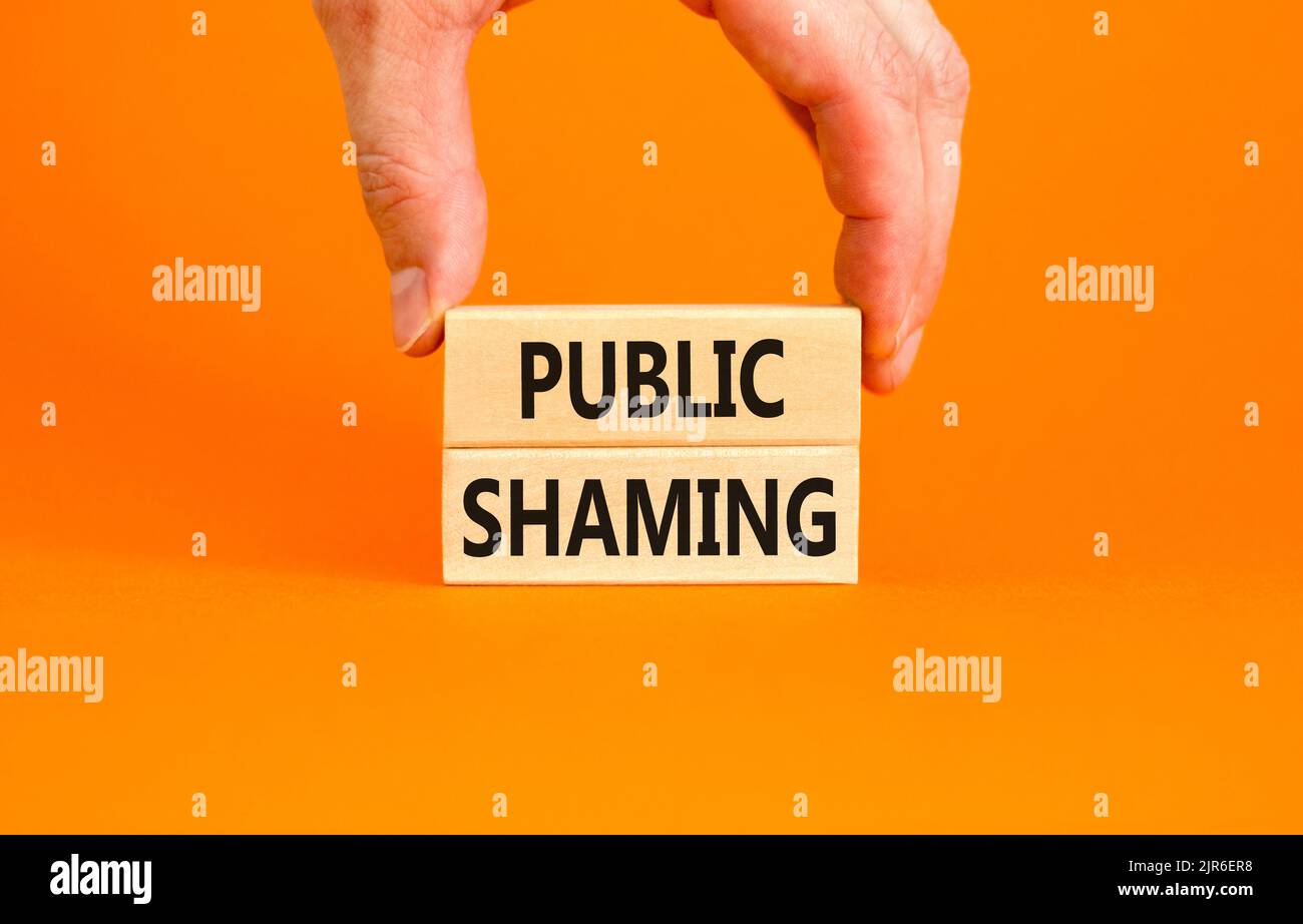 Public shaming symbol. Concept words Public shaming on wooden blocks on ...